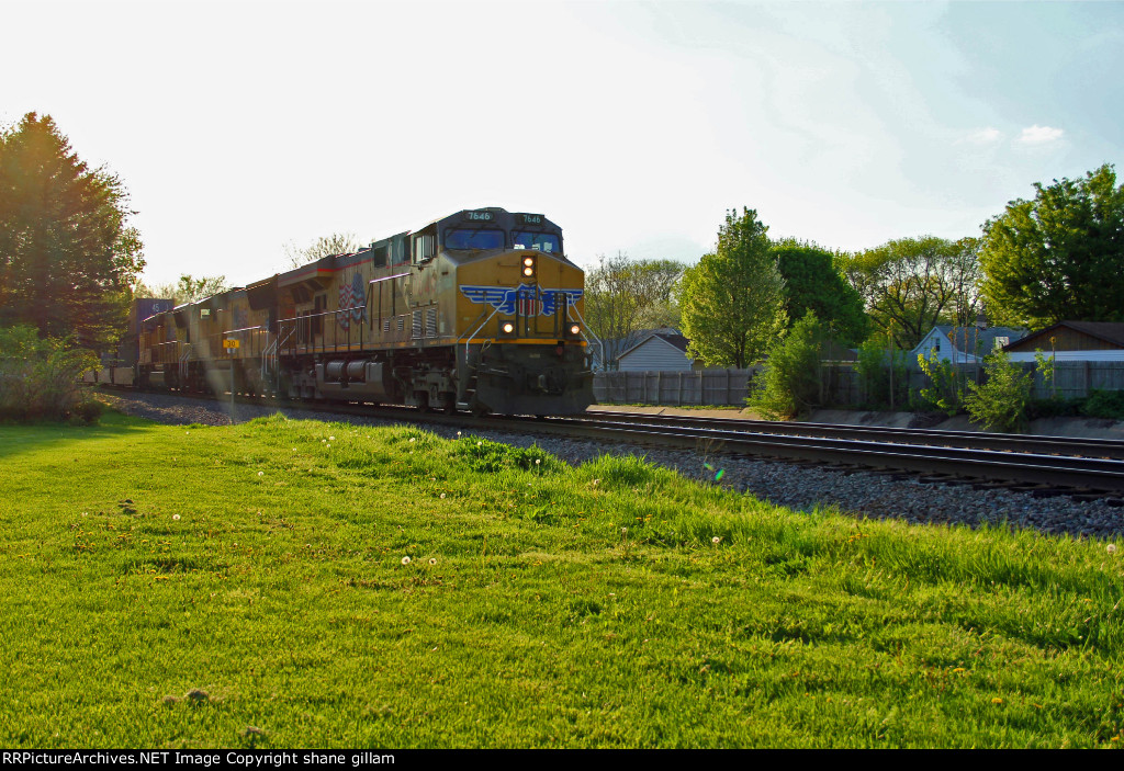 UP 7646 Heads EB at peck park.